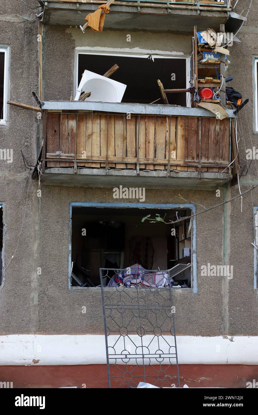 Image of broken windows, damage to the interior of a residential ...