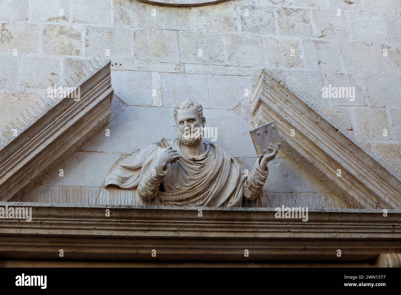 The bas relief of St. Peter over the entrance to the church of St ...