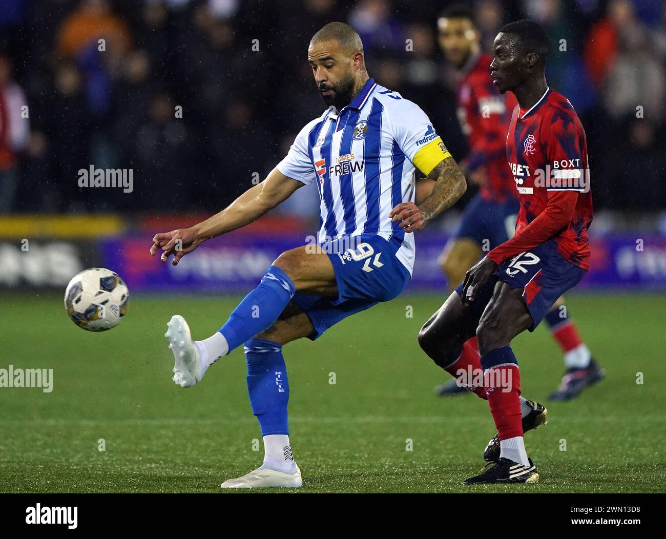 Kilmarnock's Kyle Vassell (left) and Rangers' Mohammed Diomande battle ...