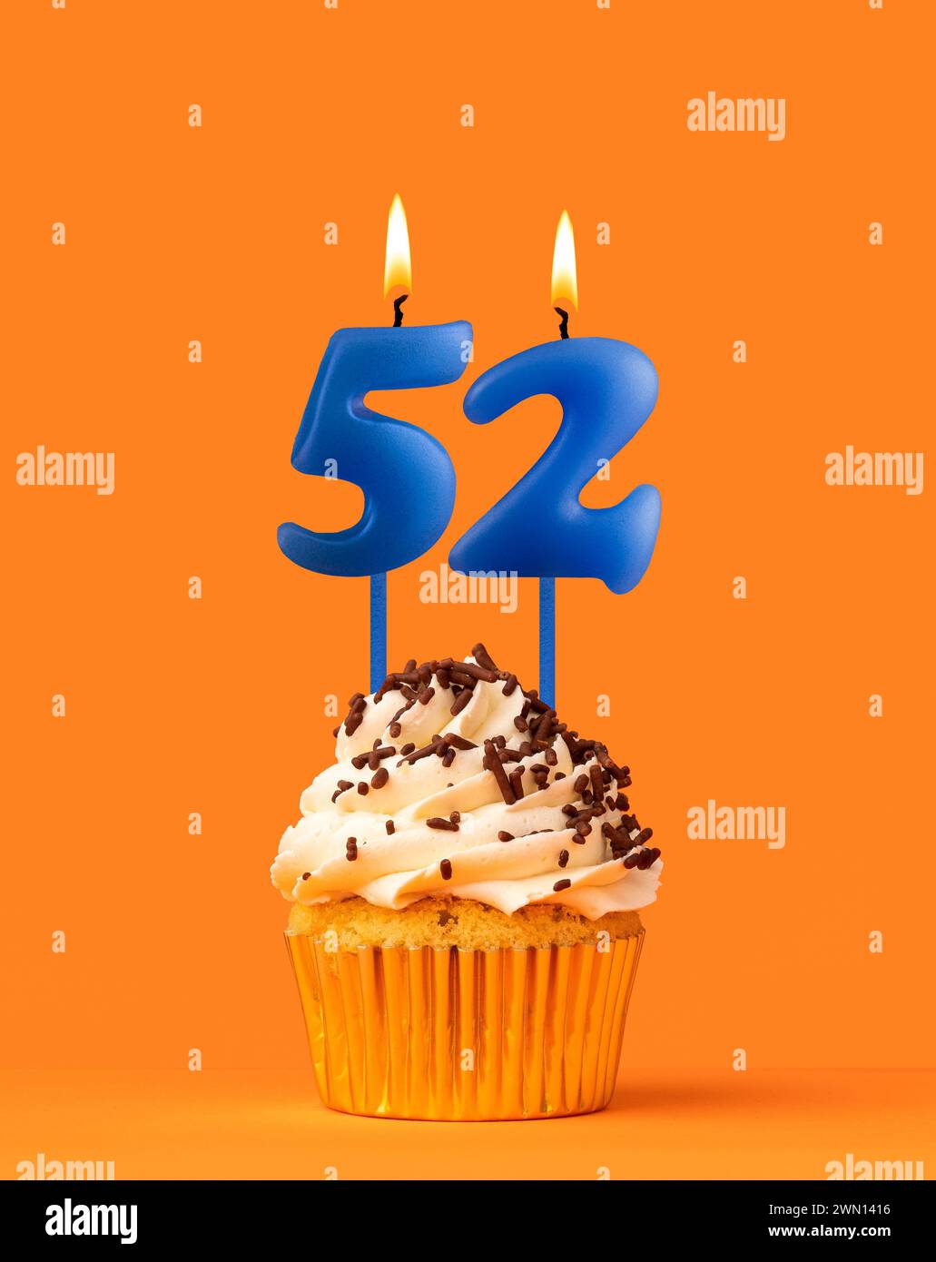 Blue birthday candle and cupcake - Number 52 Stock Photo - Alamy