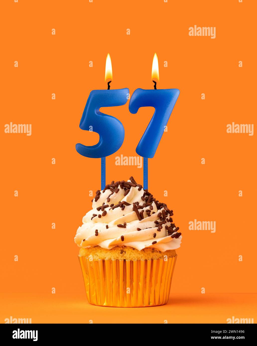 Blue candle number 57 - Birthday cupcake on orange background Stock ...