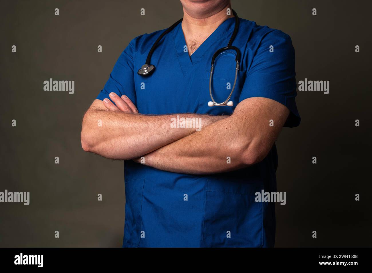 doctor with blue clothing and a stethoscope in a hospital Stock Photo ...