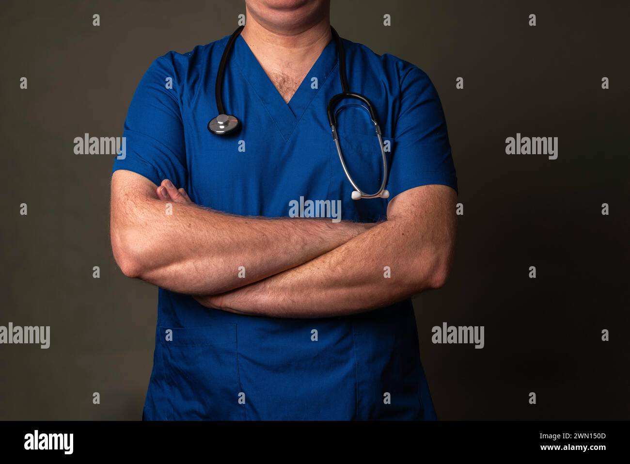 doctor with blue clothing and a stethoscope in a hospital Stock Photo ...