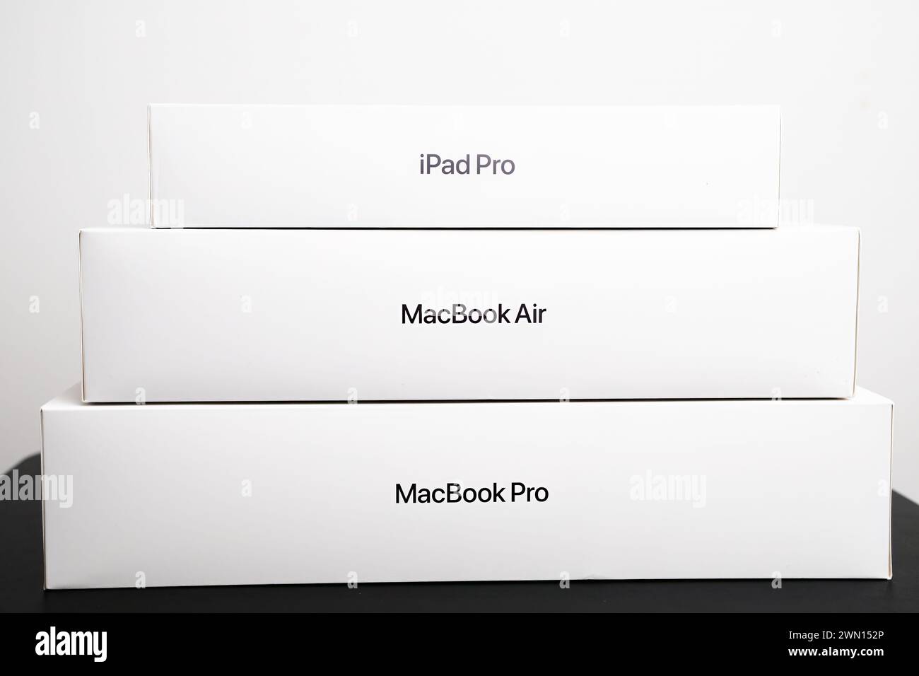 BERLIN , GERMANY - JANUARY 14 2024: MacBook Pro, MacBook Air and iPad ...