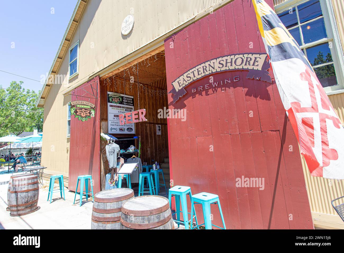 Rustic brewery entrance with vibrant flags Stock Photo - Alamy