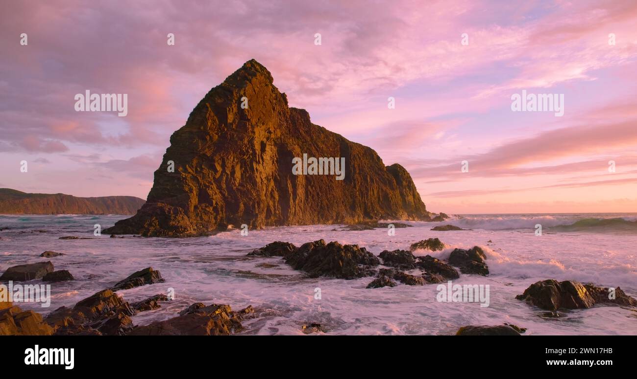 sunset view of lion rock at south cape bay in the wilderness of south ...