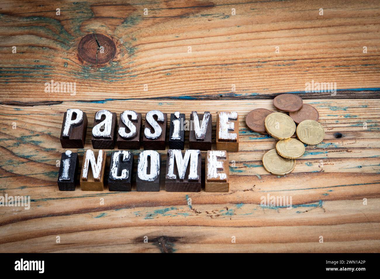 Passive income. Alphabet letters on wood texture background Stock Photo ...