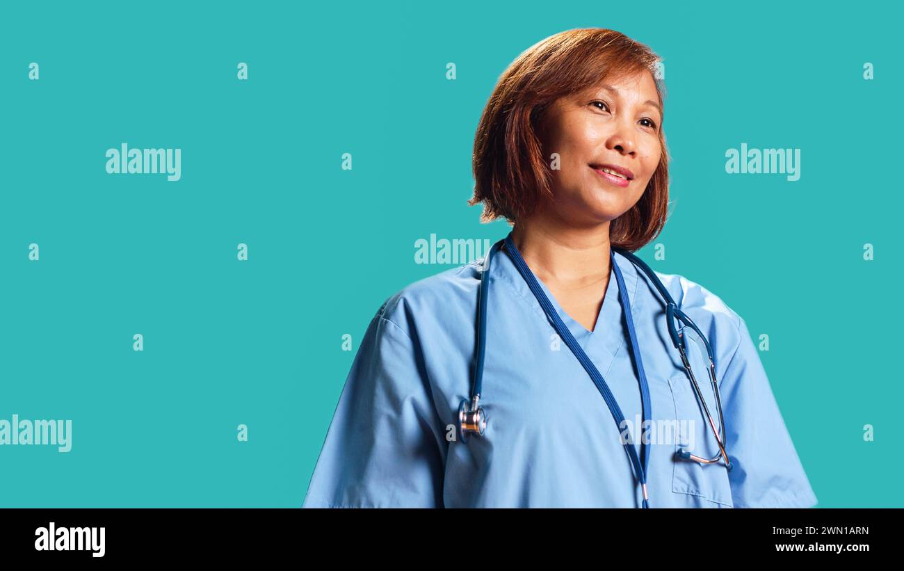 Happy proficient BIPOC nurse smiling while looking at camera. Portrait ...