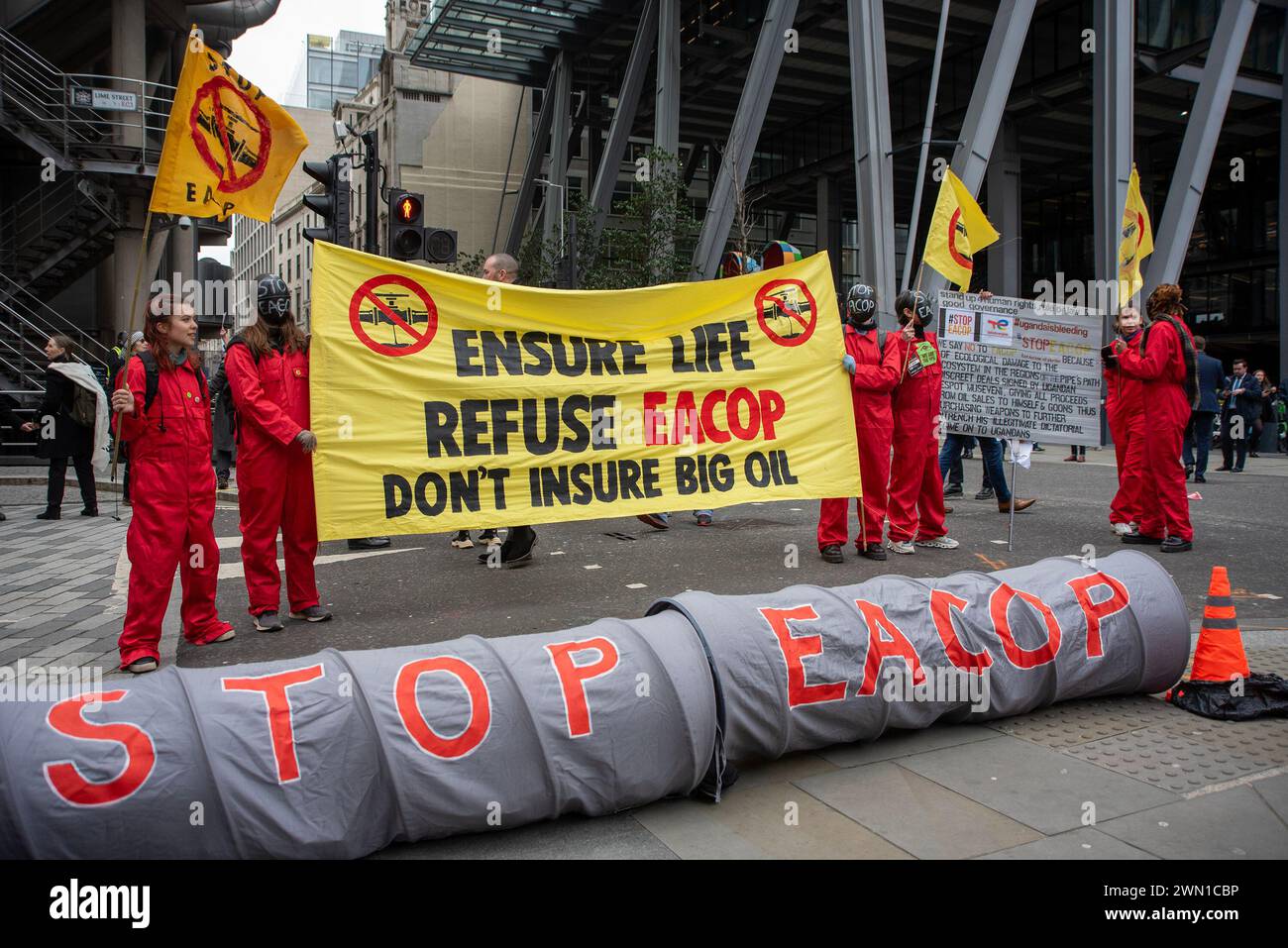 London, UK. 28th Feb, 2024. Protesters hold flags and banner by the ...