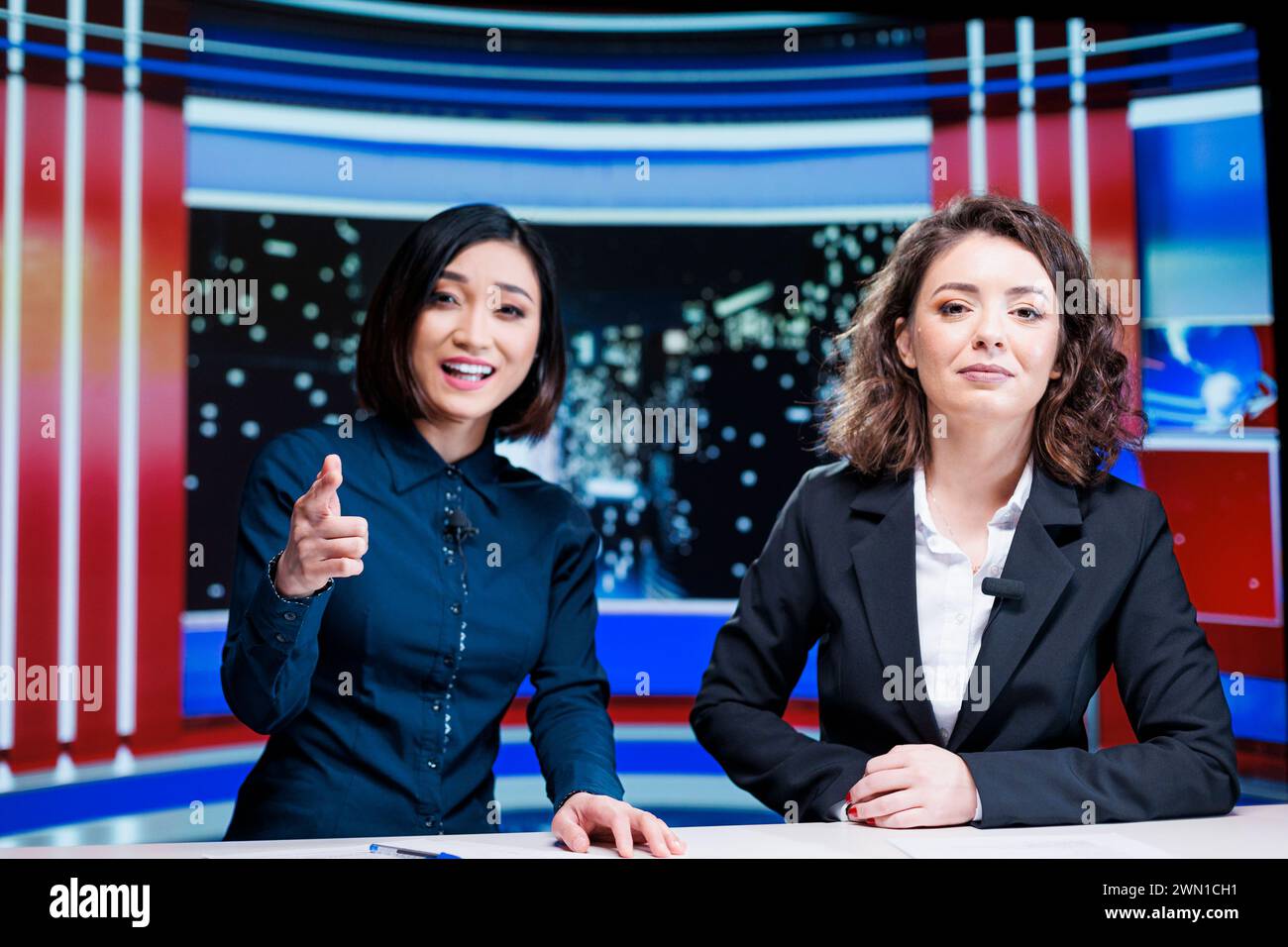 Diverse reporters talk about latest events live on television channel ...