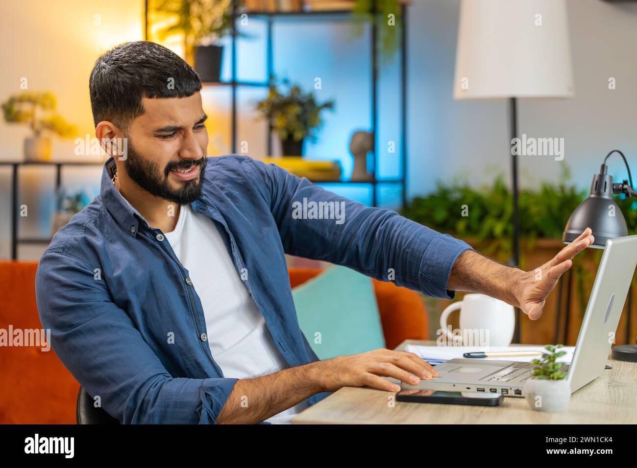 Indian man home feels headache hi-res stock photography and images - Alamy