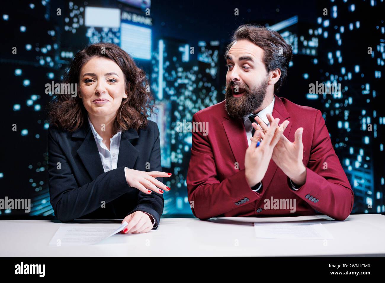 Newscasters team hosting night show hi-res stock photography and images ...