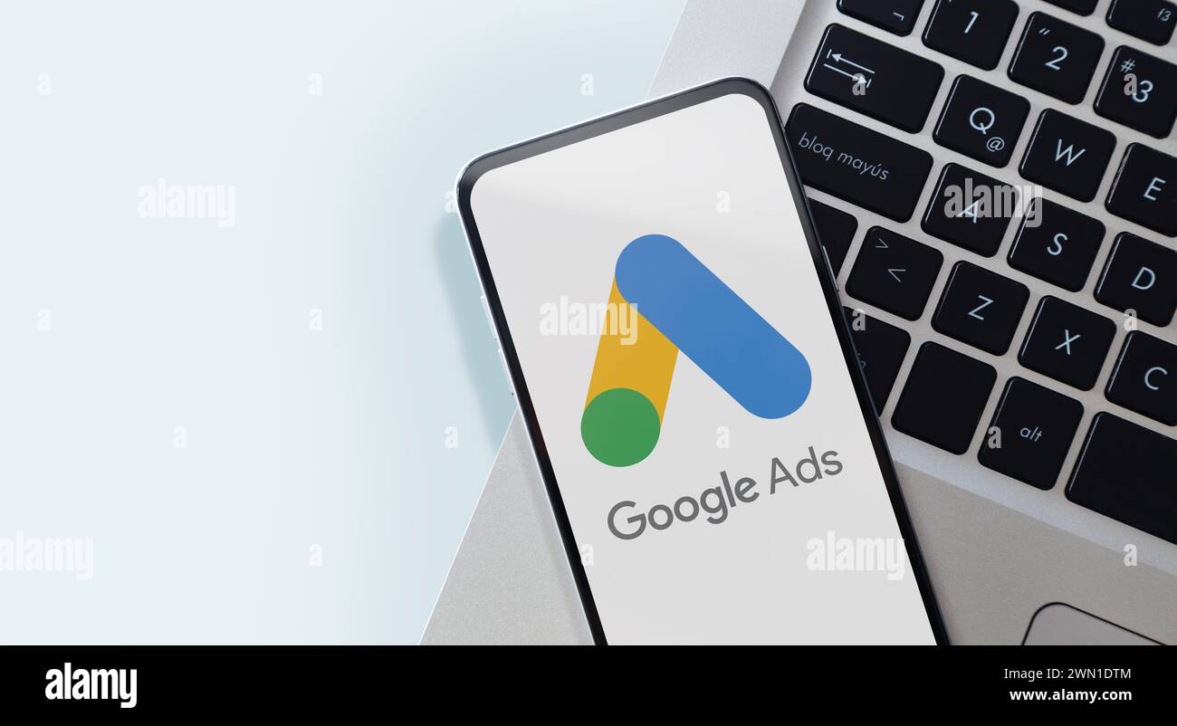 Google Ads Words on smartphone screen.Closeup of mobile phone over a ...