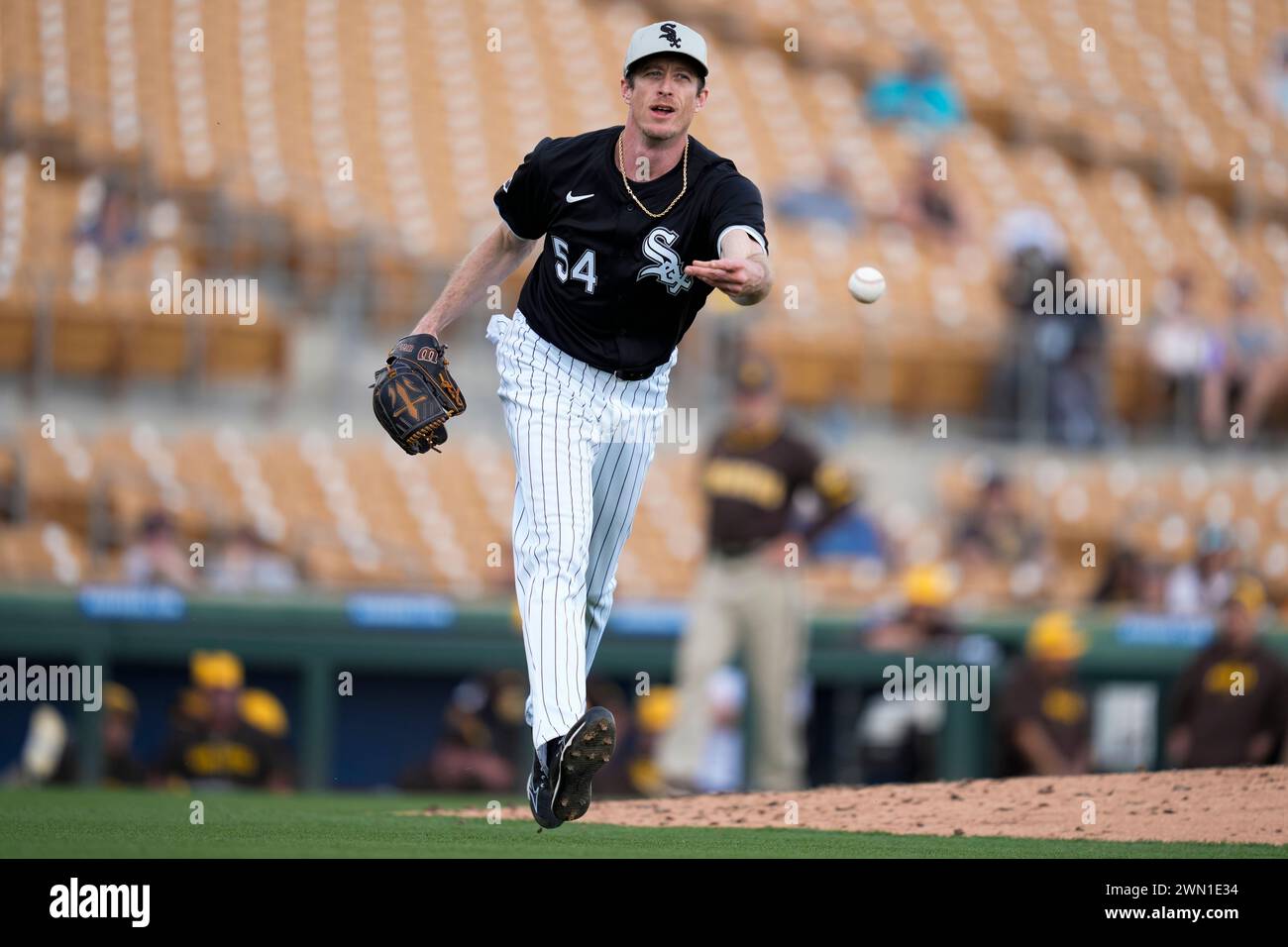 Chicago White Sox relief pitcher Tim Hill throws to first to out San ...