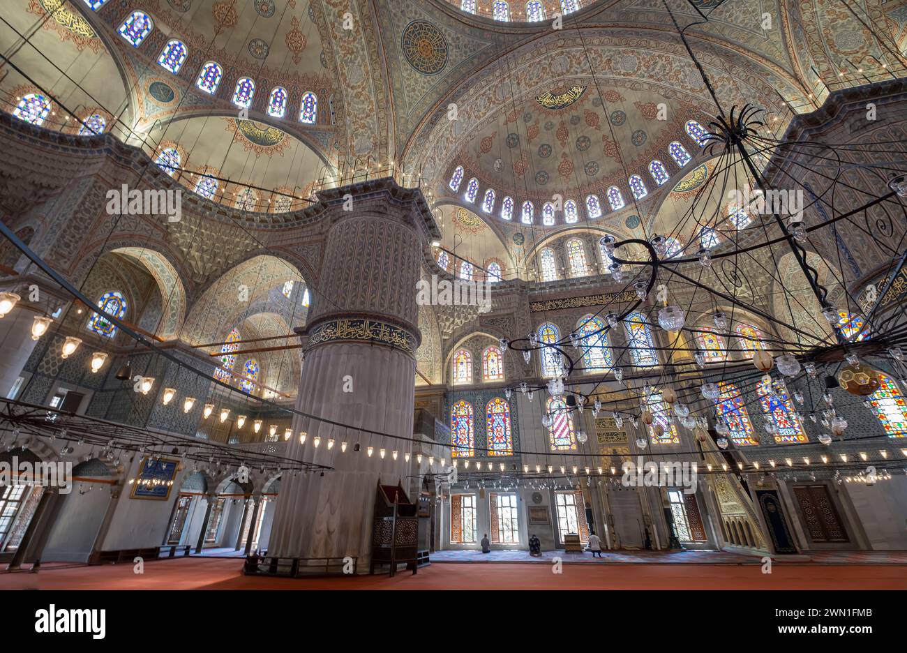 interior of the blue mosque in istanbul, with its colorful stained ...