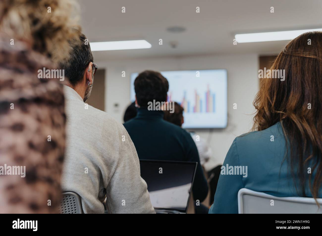 Successful multi generational team analyzing growth and brainstorming ...