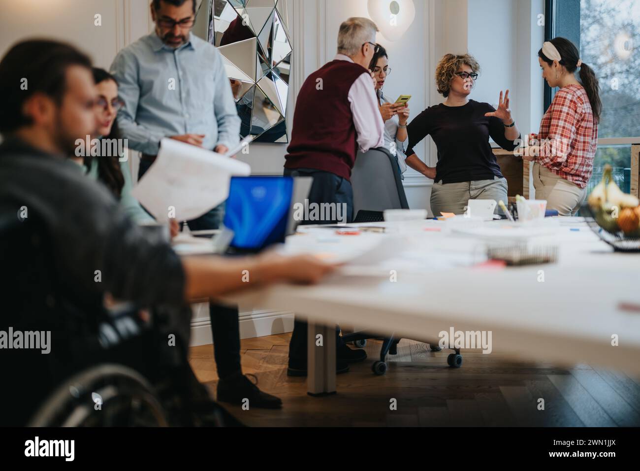 Multicultural, cross generational business team in brainstorming ...