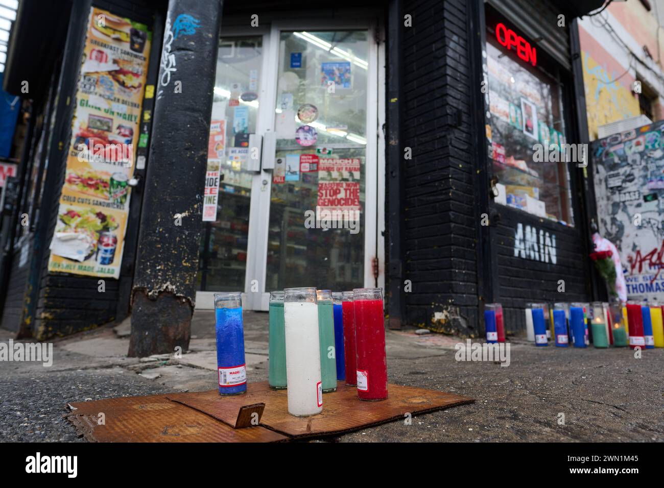 New York, New York, USA. 28th Feb, 2024. A growing memorial of candles ...