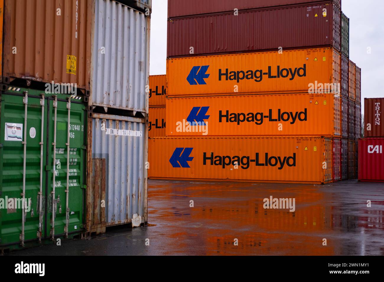 Shipping containers largest shipping and transportation companies stacked in port, Hapag-lloyd ...