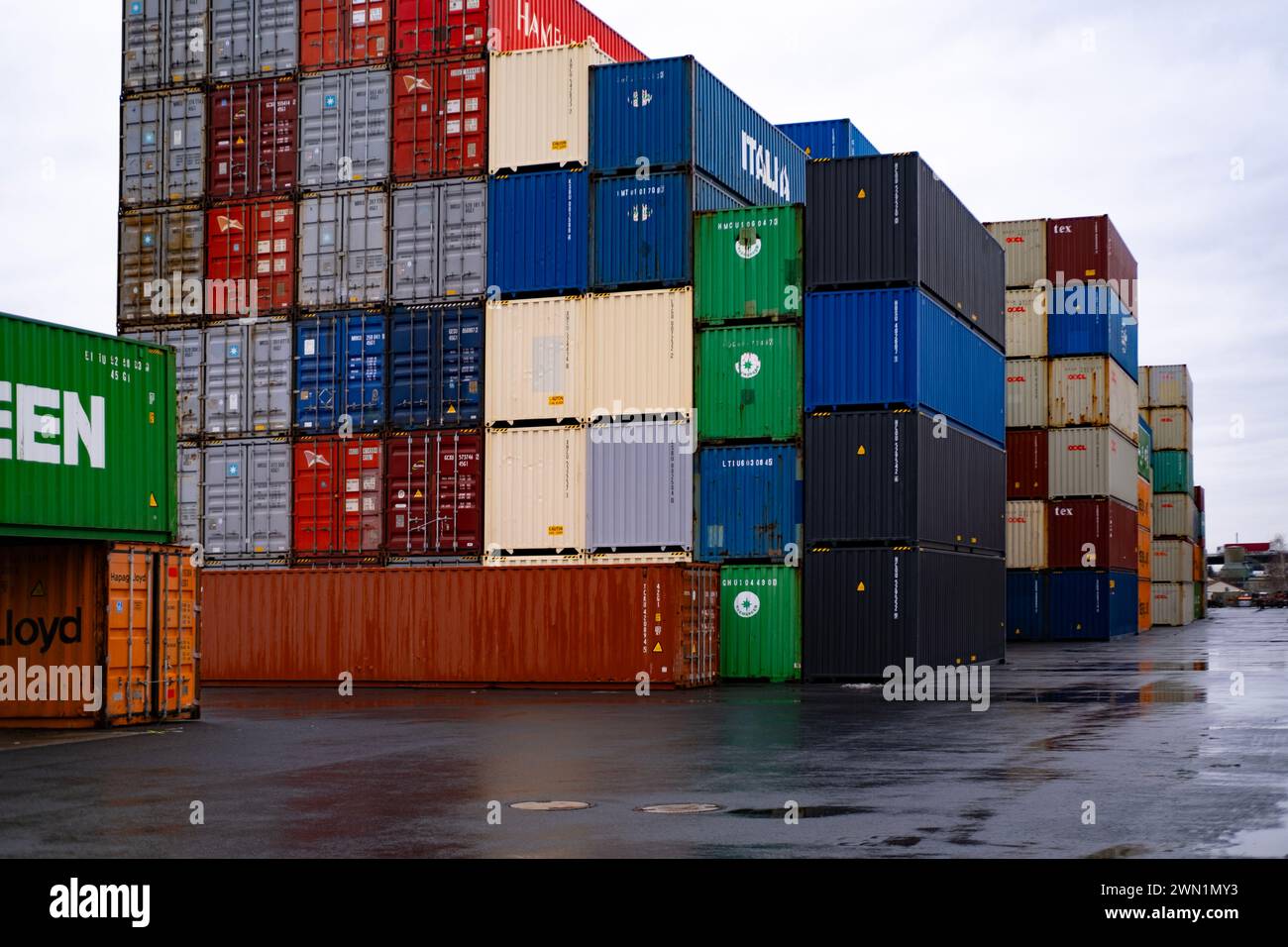 Shipping containers largest shipping and transportation companies stacked in port, Hapag-lloyd ...