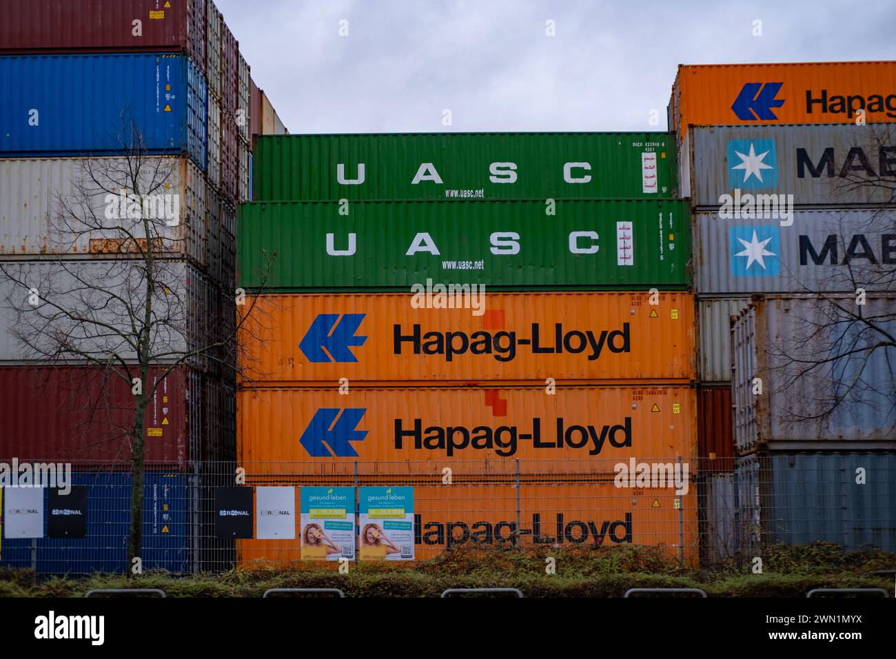 Shipping containers largest shipping and transportation companies stacked in port, Hapag-lloyd ...