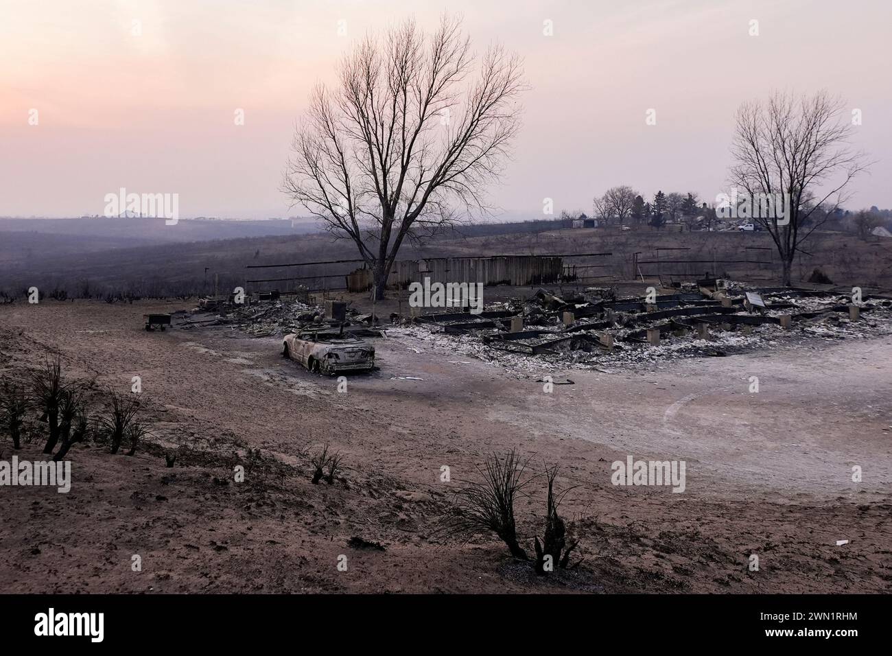 The charred remains of a home burned by the Smokehouse Creek Fire are ...