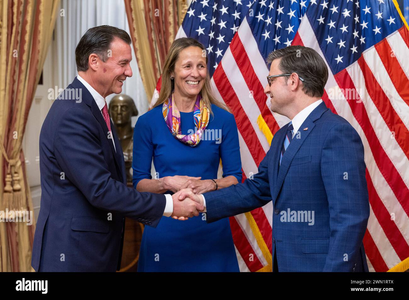 Rep. Tom Suozzi, D-N.Y., shakes hands with House Speaker Mike Johnson ...