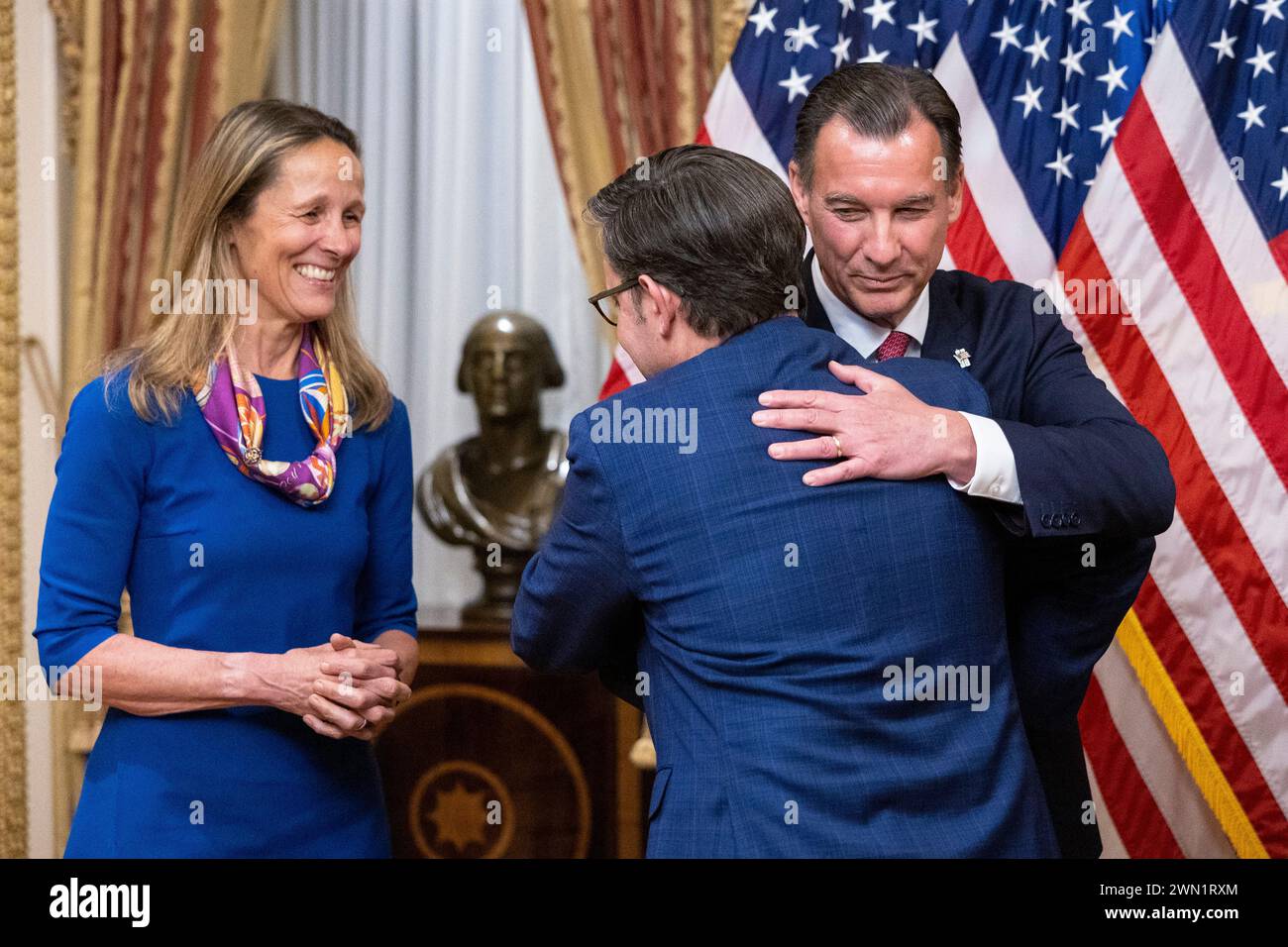 Rep. Tom Suozzi, D-N.Y., gets a hug from House Speaker Mike Johnson, R ...