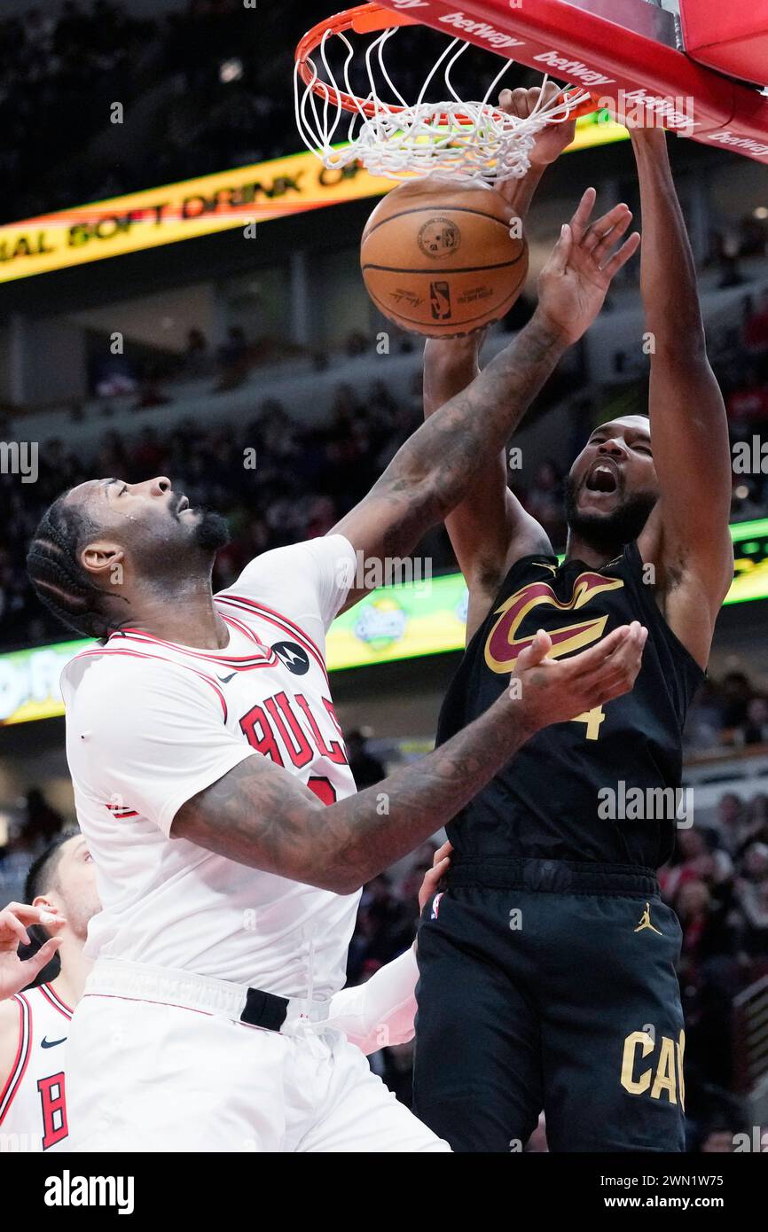 Cleveland Cavaliers forward Evan Mobley, right, dunks against Chicago ...