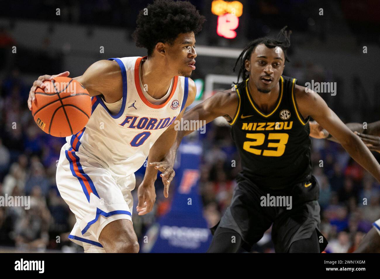 Florida guard Zyon Pullin (0) drives against Missouri forward Aidan Shaw (23) during the second ...