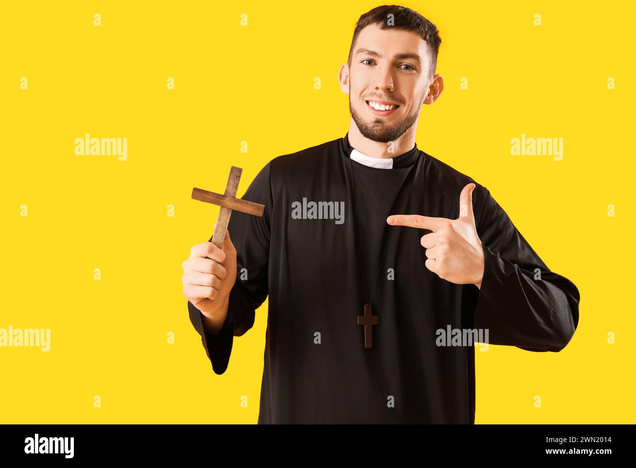 Young religious happy priest hi-res stock photography and images - Alamy