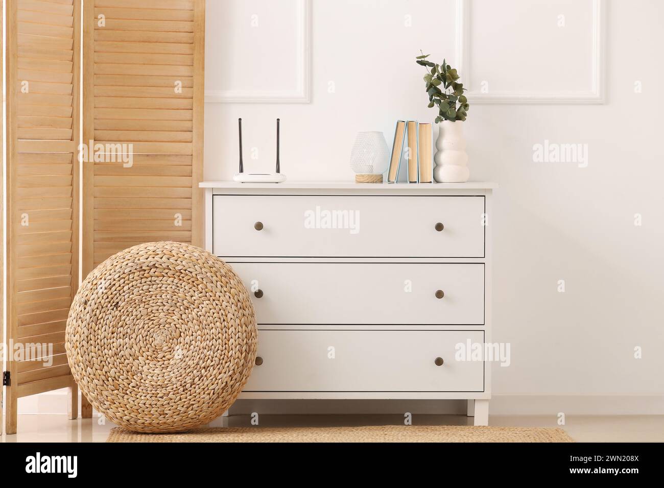 Interior of living room with wi-fi router on commode Stock Photo - Alamy