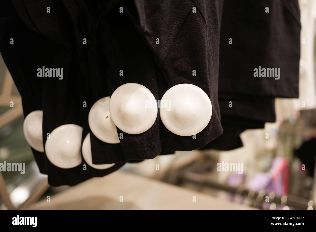 Security tags on clothes hi-res stock photography and images - Alamy