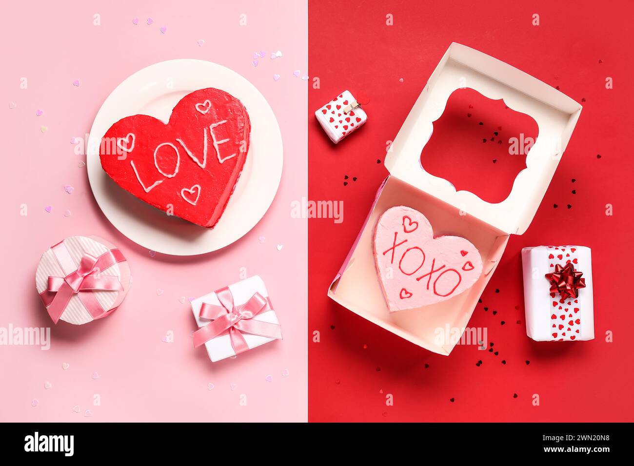 Heart-shaped bento cakes with gift boxes on color background. Valentine ...