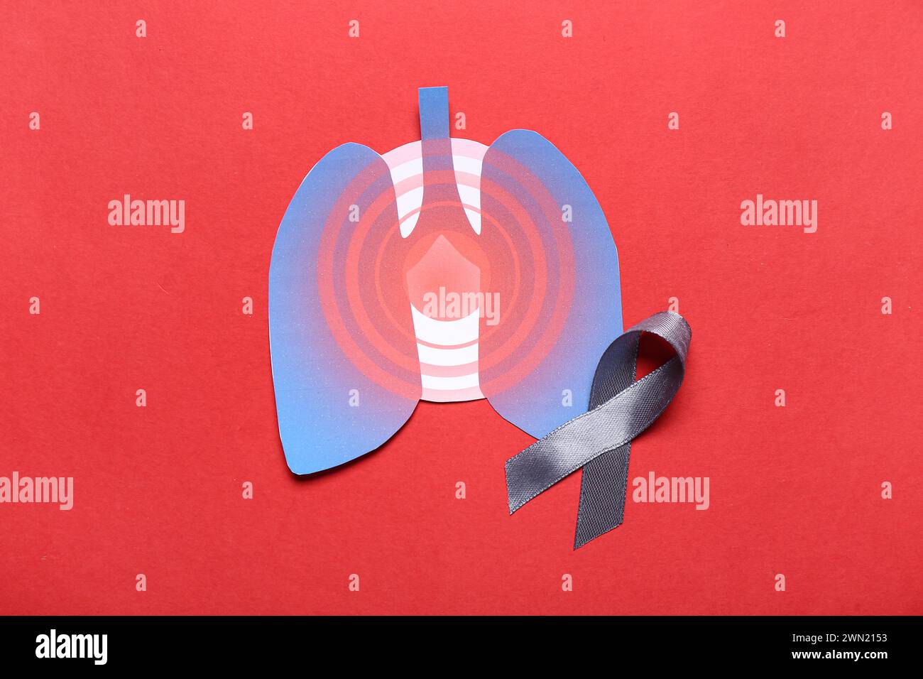 Paper lungs with grey ribbon on red background Stock Photo - Alamy