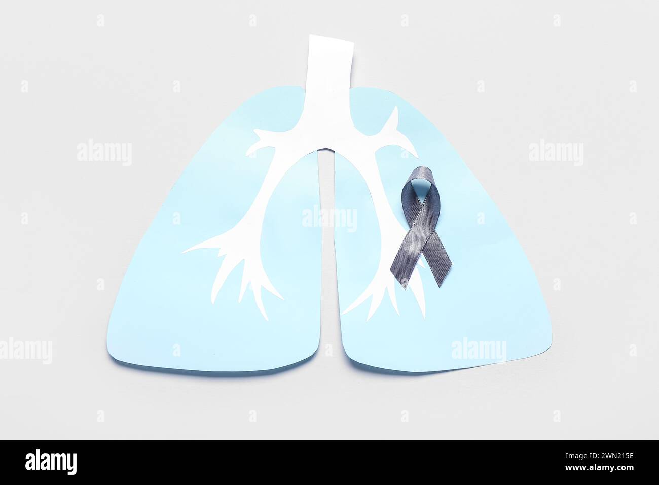 Paper lungs with ribbon on grey background Stock Photo - Alamy