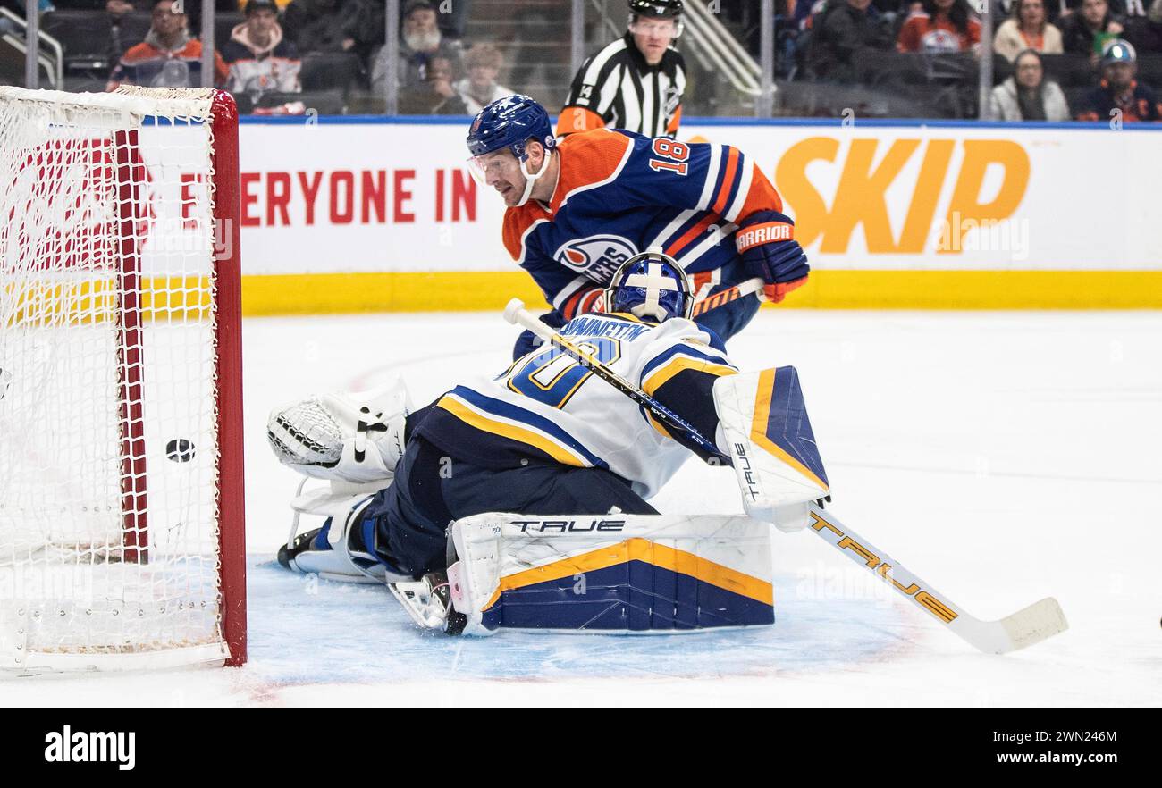 Edmonton Oilers' Zach Hyman (18) scores against St. Louis Blues goalie ...