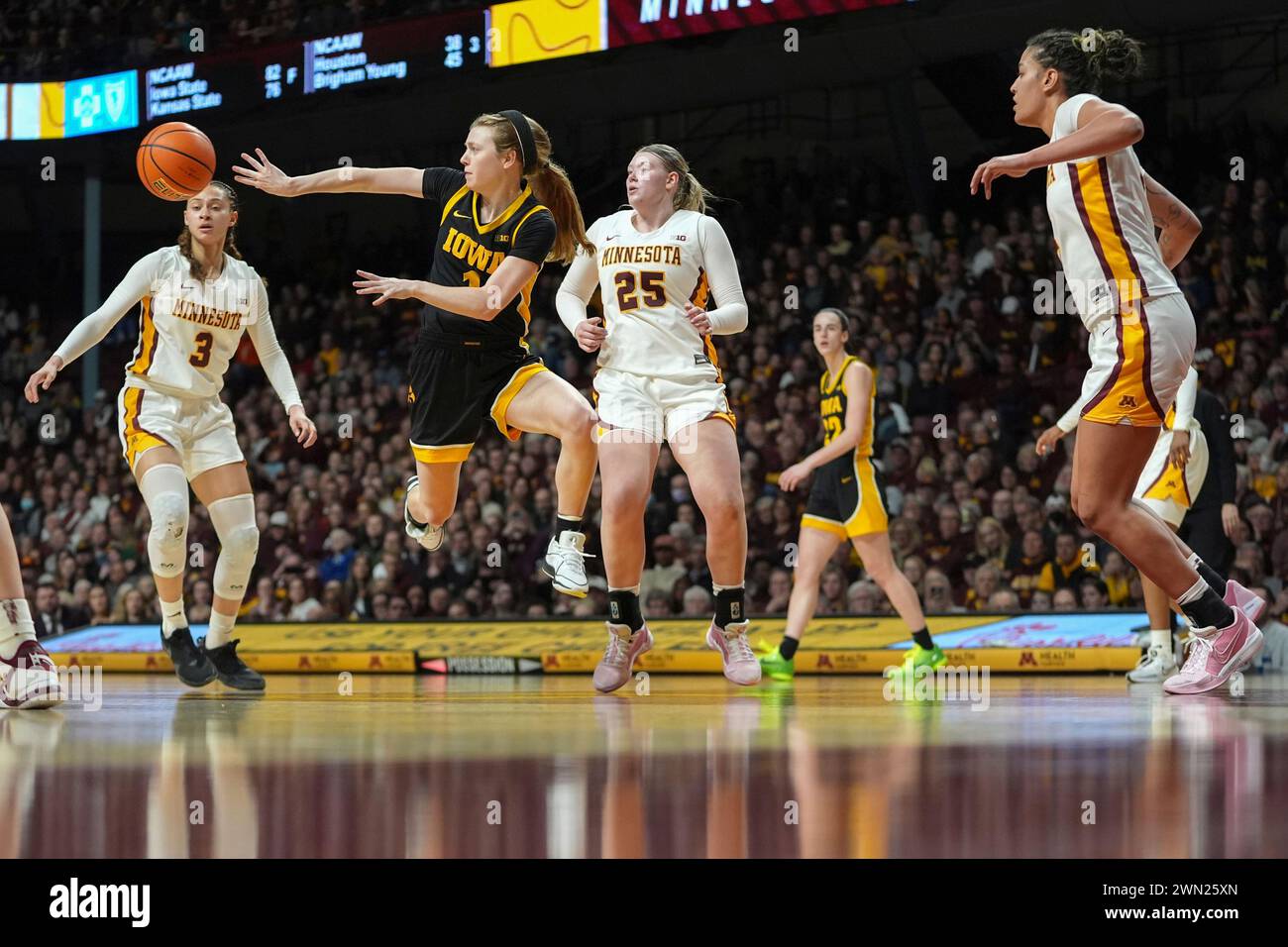 Iowa guard Molly Davis, center left, passes during the second half of ...