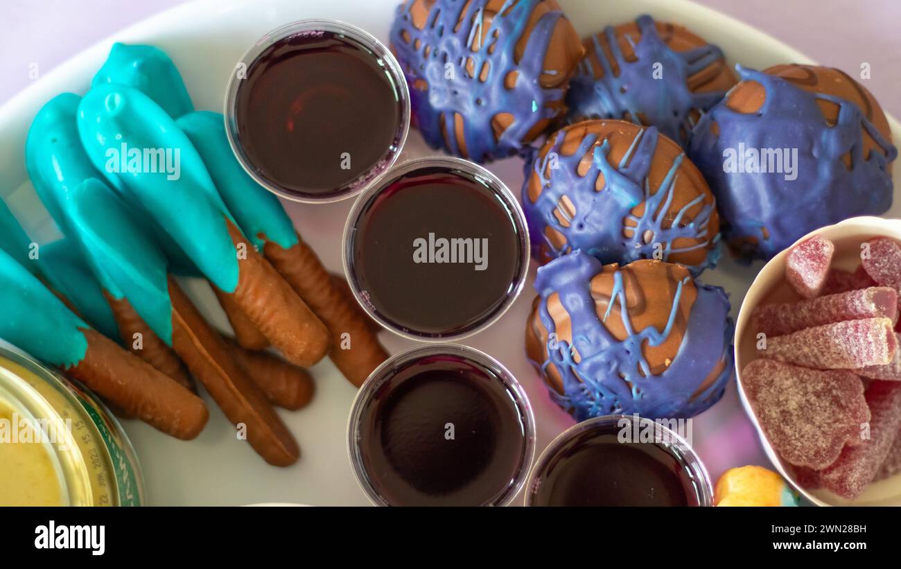 A party platter for a child's birthday party with colourful sweet foods ...