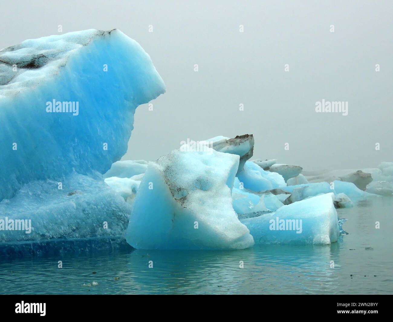 large blue icebergs floating in summer at jokulsarlon glacier lagoon ...