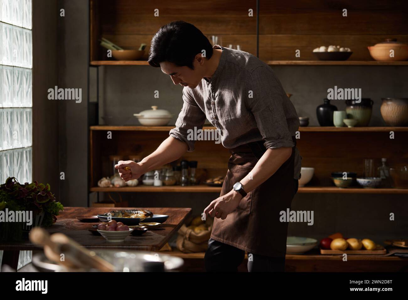 Cook making dishes in the kitchen Stock Photo - Alamy
