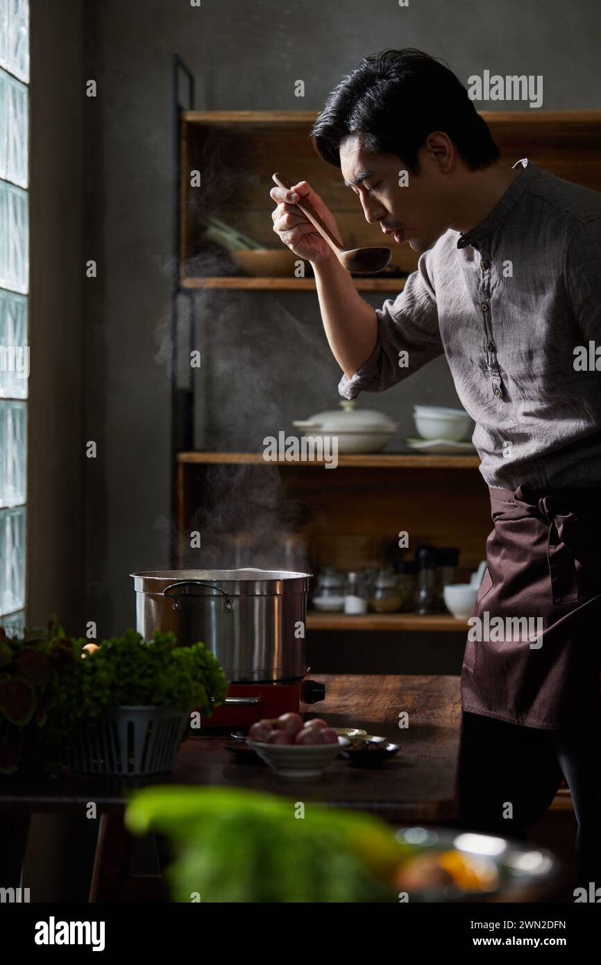 Cook making dishes in the kitchen Stock Photo - Alamy