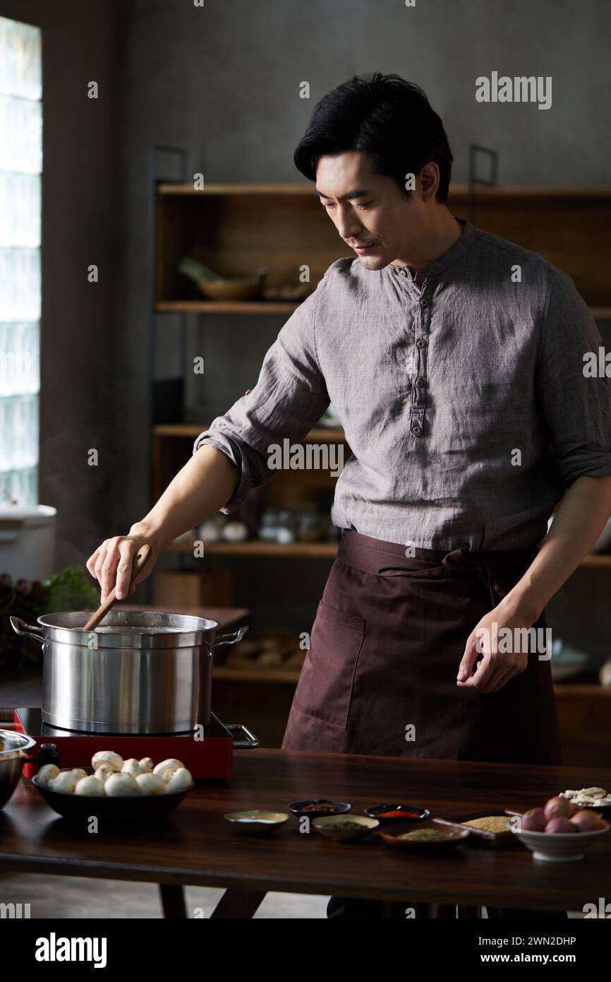 Cook making dishes in the kitchen Stock Photo - Alamy