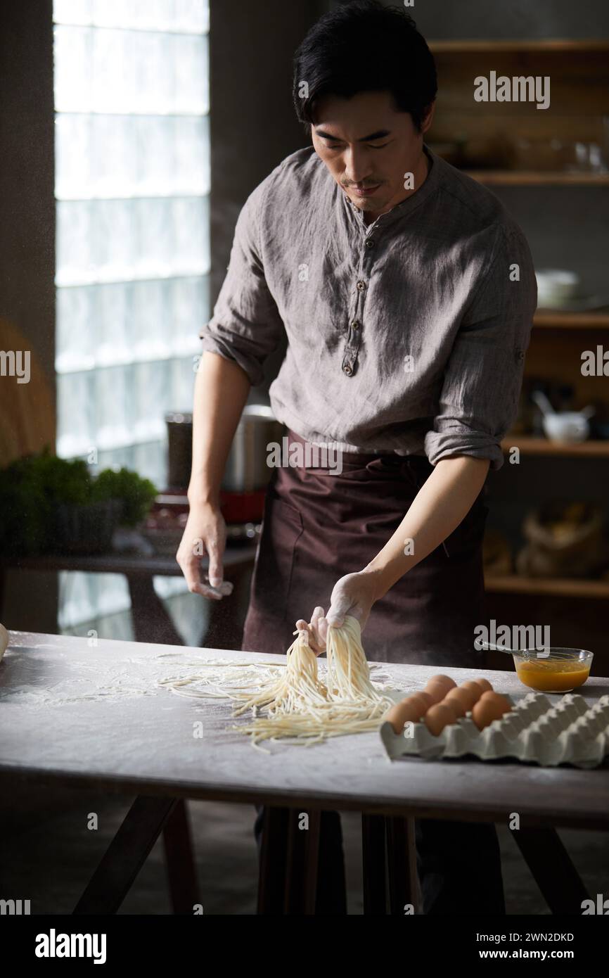 Cook making dishes in the kitchen Stock Photo - Alamy