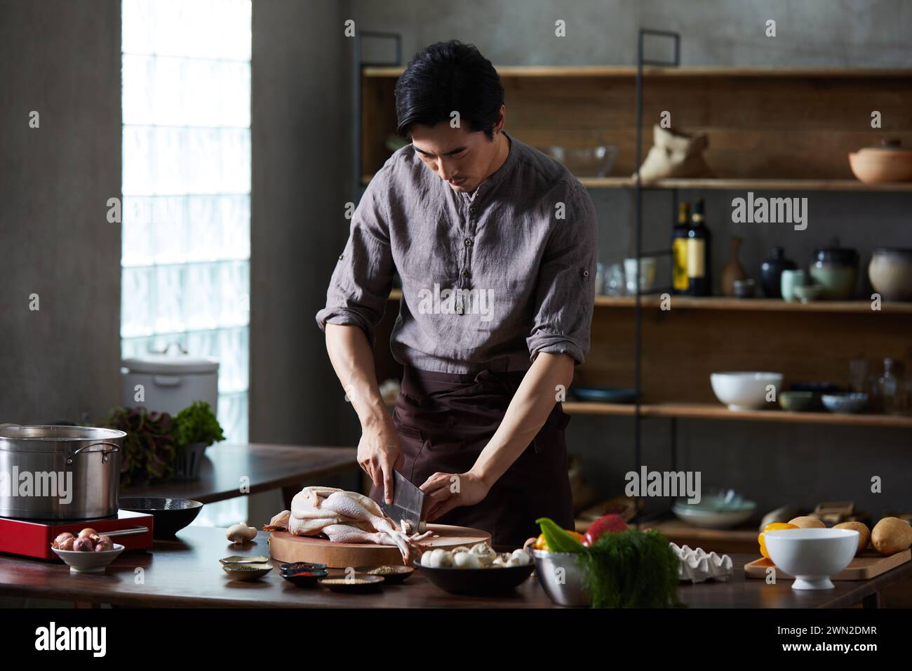 Cook making dishes in the kitchen Stock Photo - Alamy
