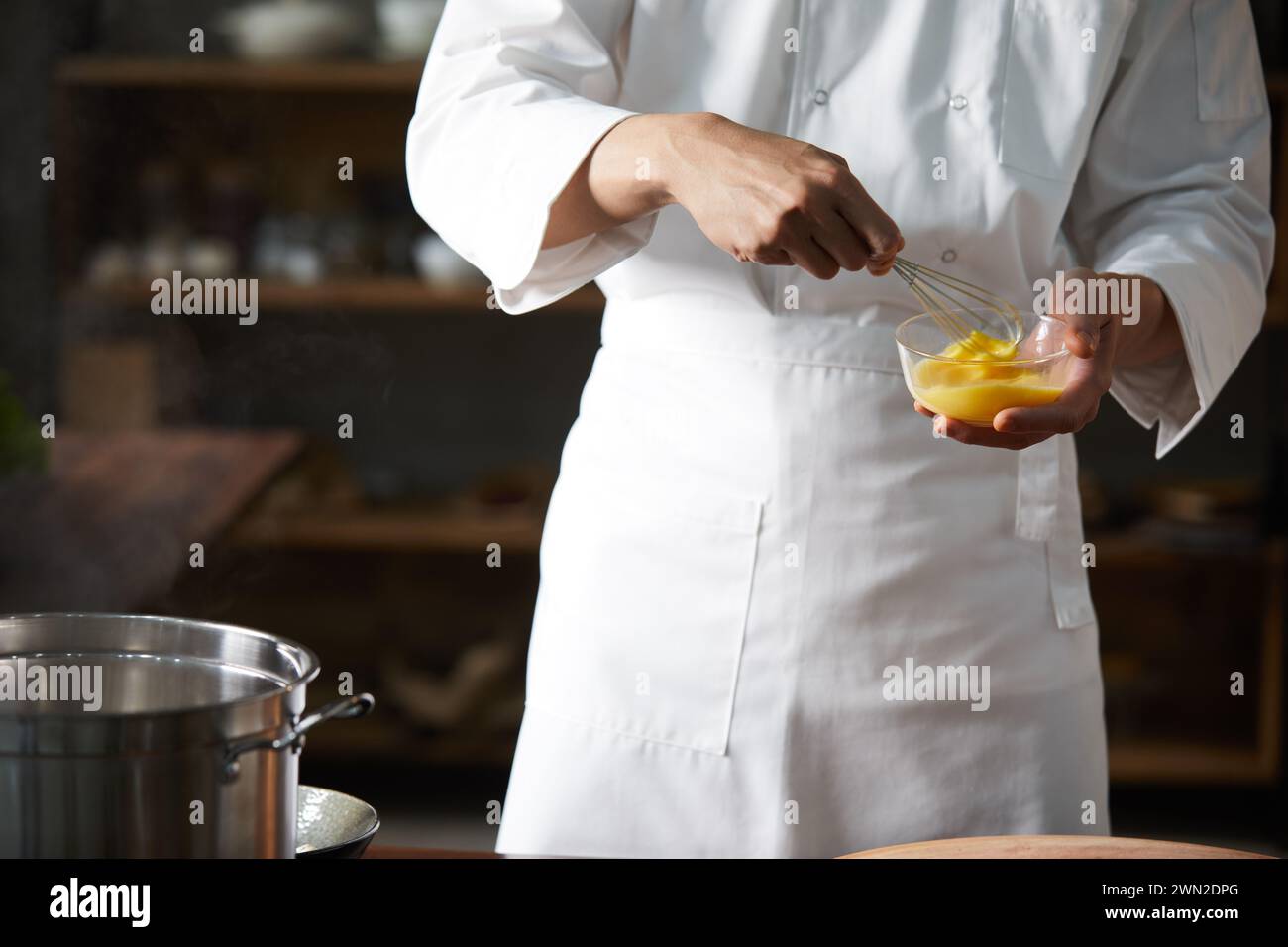 Cook making dishes in the kitchen Stock Photo - Alamy