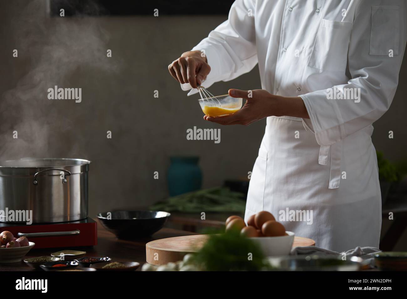 Cook making dishes in the kitchen Stock Photo - Alamy