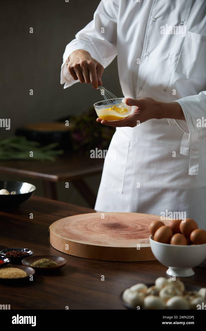 Cook making dishes in the kitchen Stock Photo - Alamy