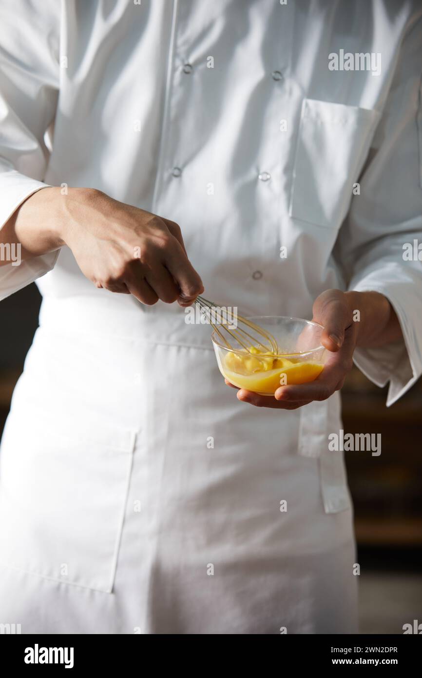 Cook making dishes in the kitchen Stock Photo - Alamy