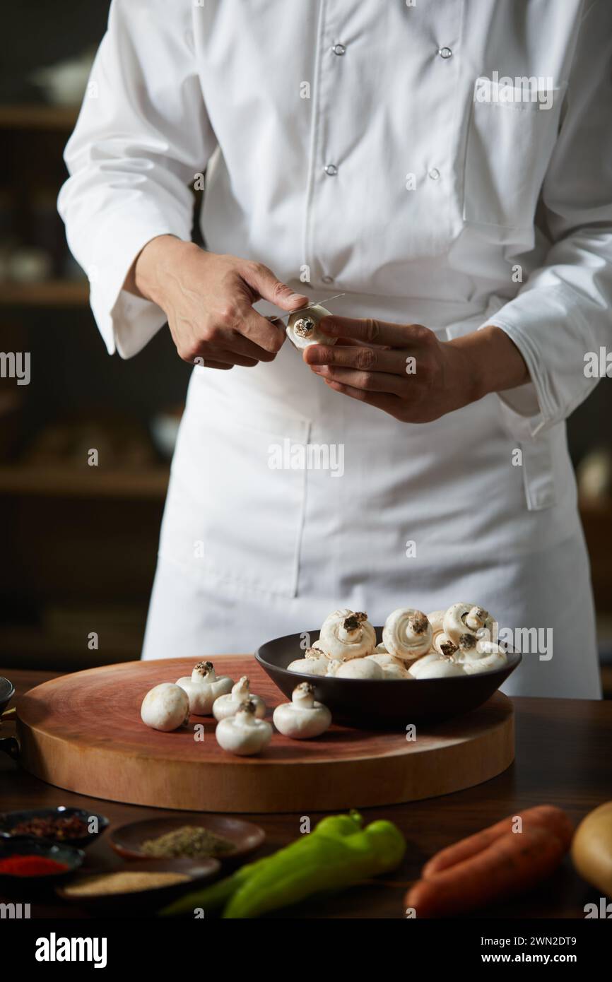 Cook making dishes in the kitchen Stock Photo - Alamy
